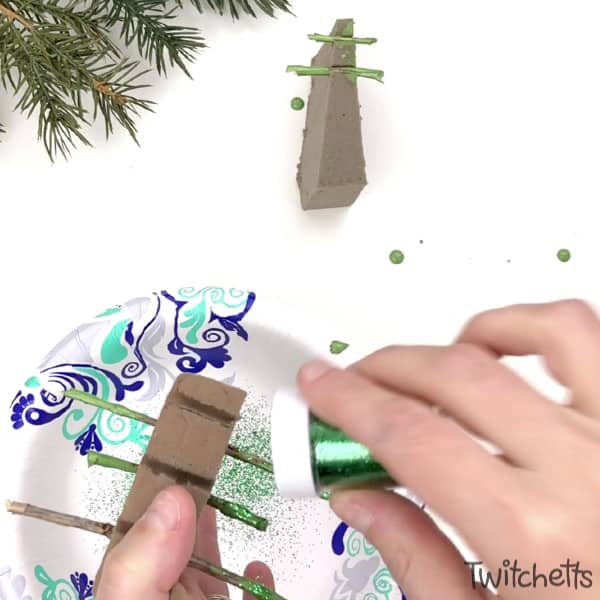 How to make sparkly tree-shaped Christmas ornaments using sticks