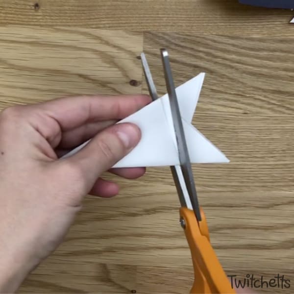 How to make a six-sided snowflake paper craft with inked edges.