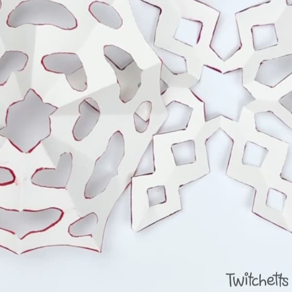 How to make a six-sided snowflake paper craft with inked edges.