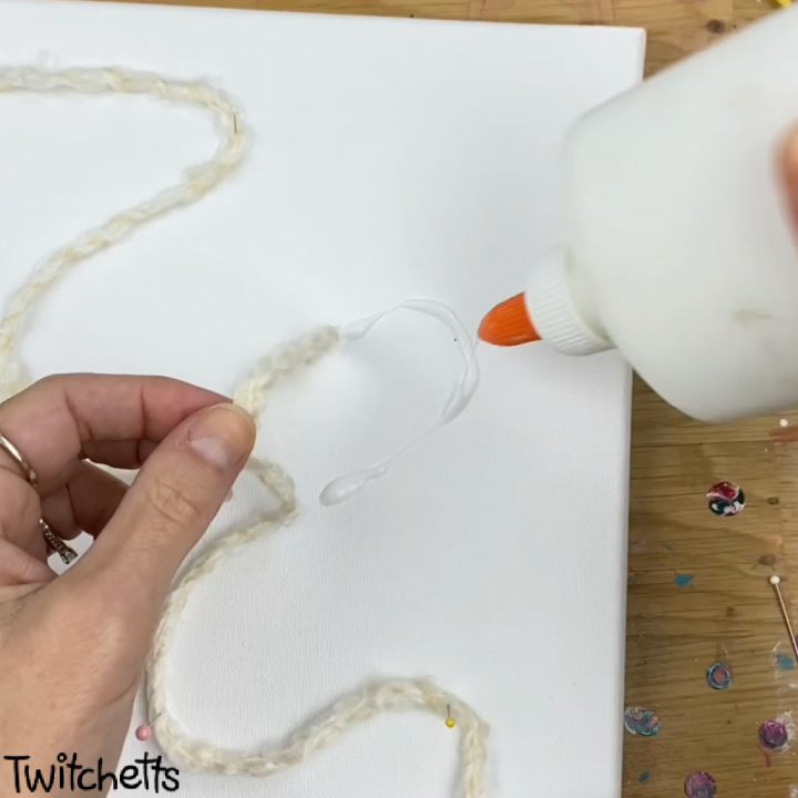 How to make DIY Yarn Canvas Art for unique wall art - Twitchetts