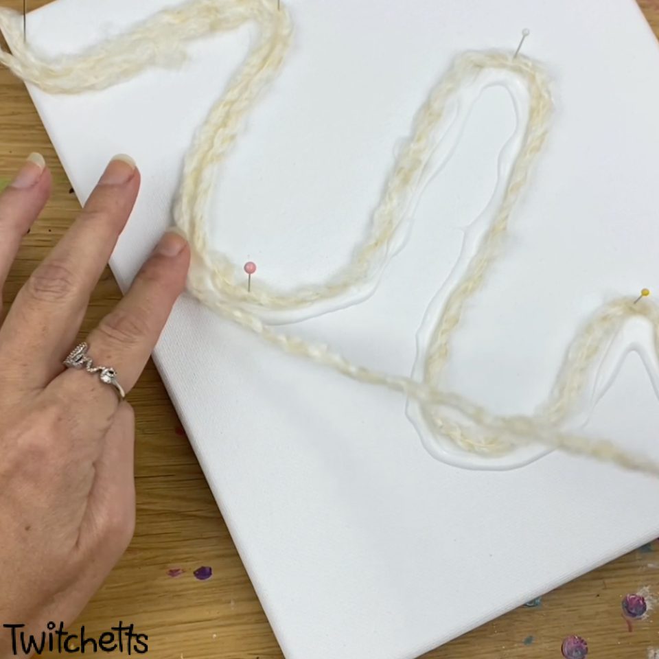 How to make DIY Yarn Canvas Art for unique wall art - Twitchetts